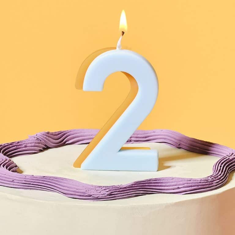Blue and yellow number 2 candle – The Wraperie